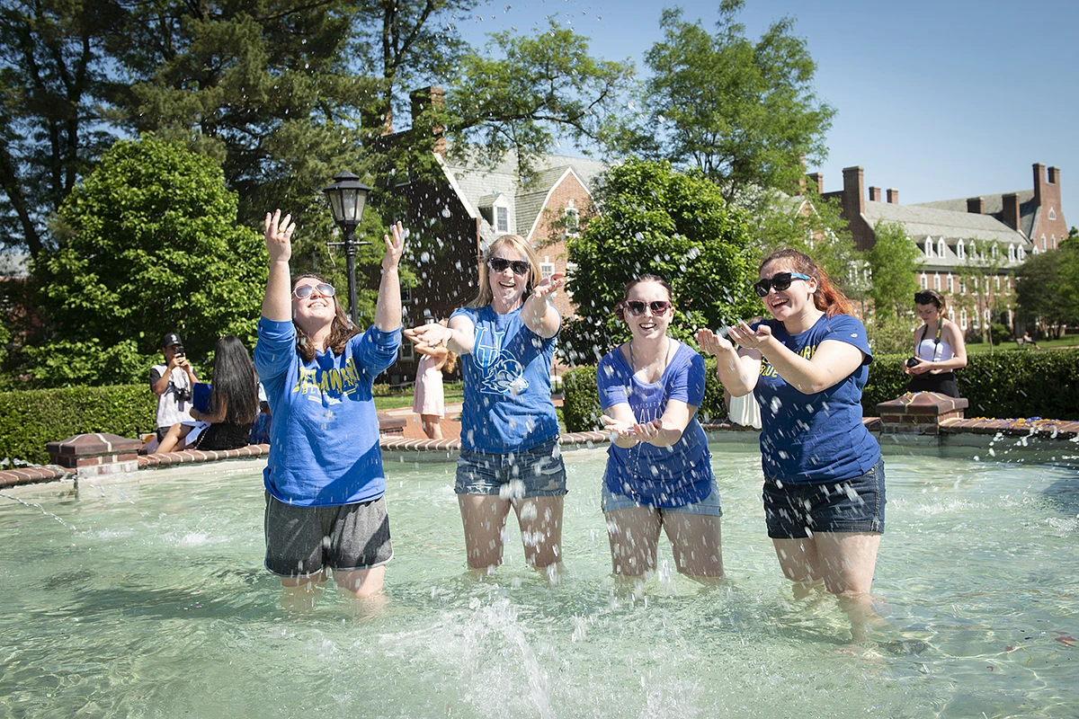 Grad photos at the fountain | The Blue Hen Family Hub